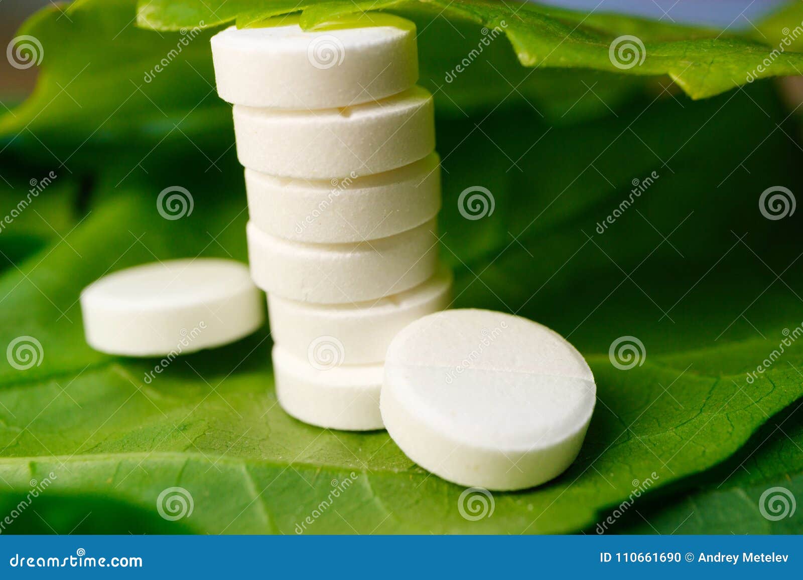 A Pillar Made of Medical Tablets Which is Covered with a Green Leaf, a ...