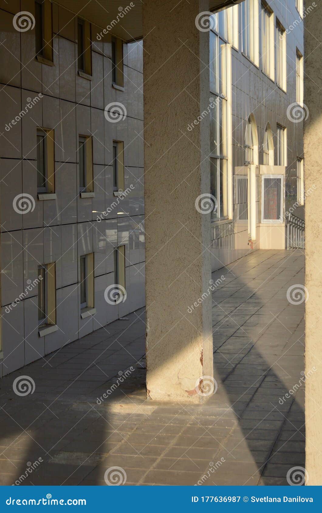 Pillar on the Porch of the Building with Windows of Different Sizes ...