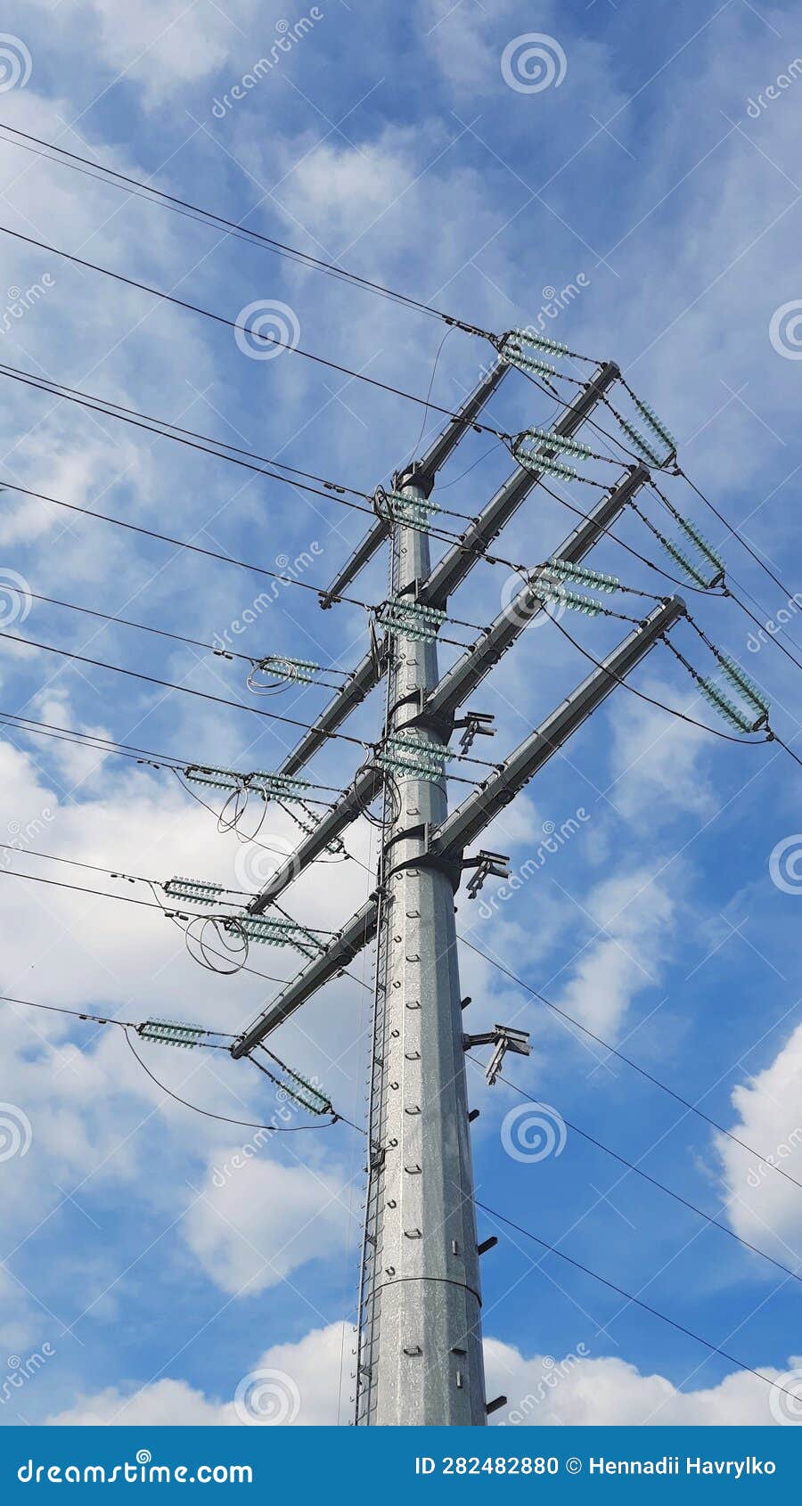 Pillar and Power Lines Against a Cloudy Sky Stock Photo - Image of ...