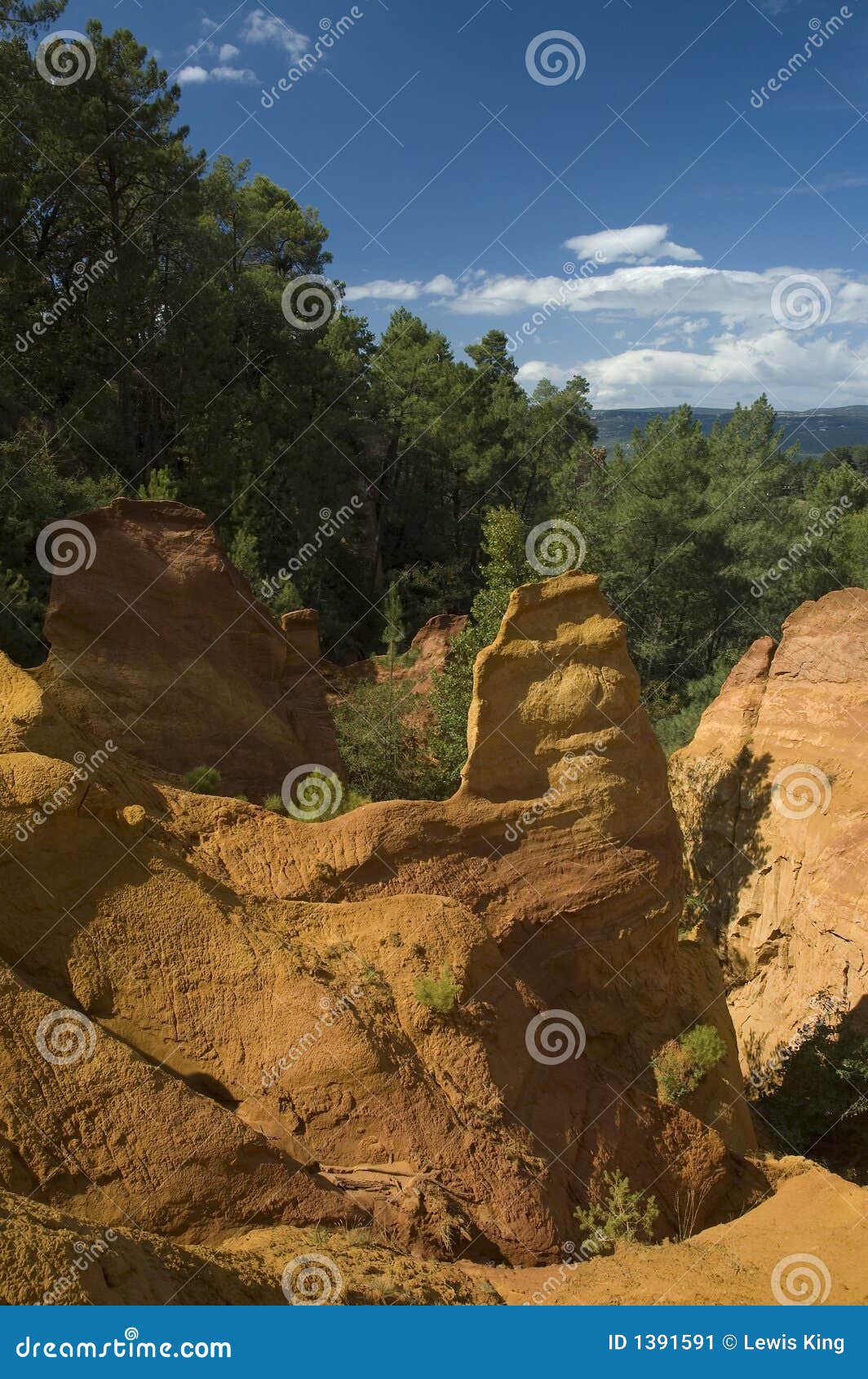 Pillars of Red Ochre with Blue Sky and Trees Stock Image - Image of ...