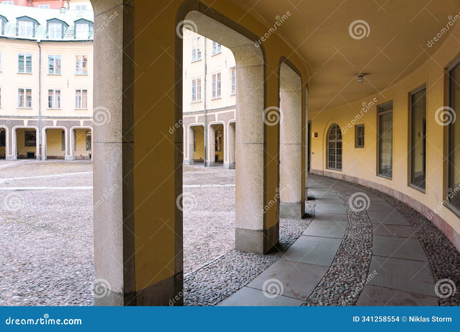Pillars at the Town Square between the Buildings Stock Photo - Image of ...