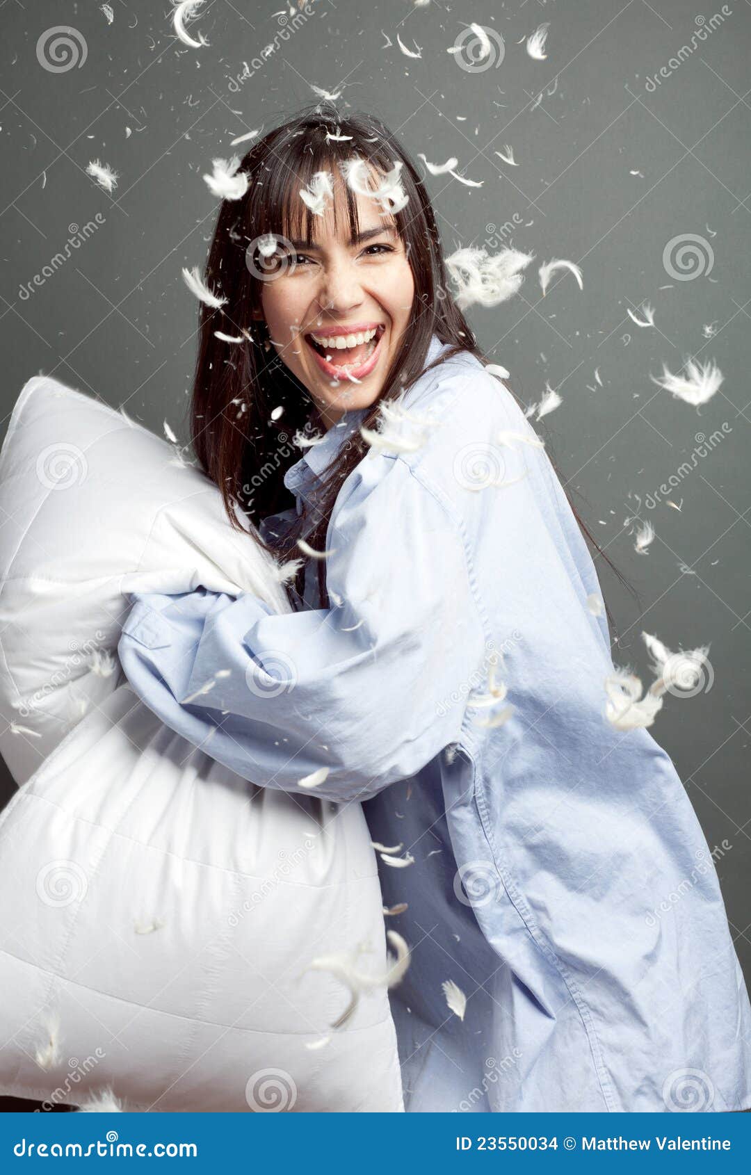 Pillow Fight with Happy Woman Stock Photo - Image of playful, feathers ...