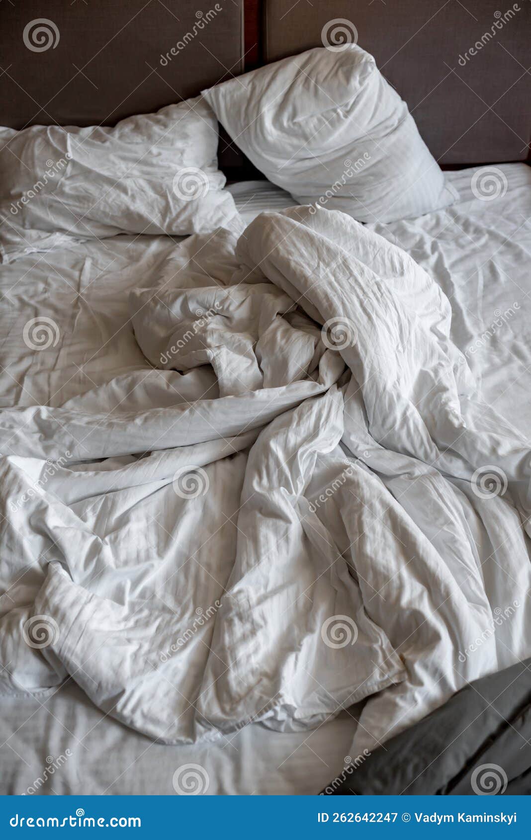 Unmade bedding on the bed stock image. Image of home - 262642247