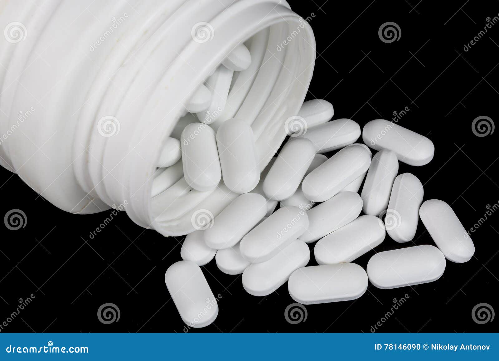 Pills from bottle on black stock photo. Image of cure - 78146090