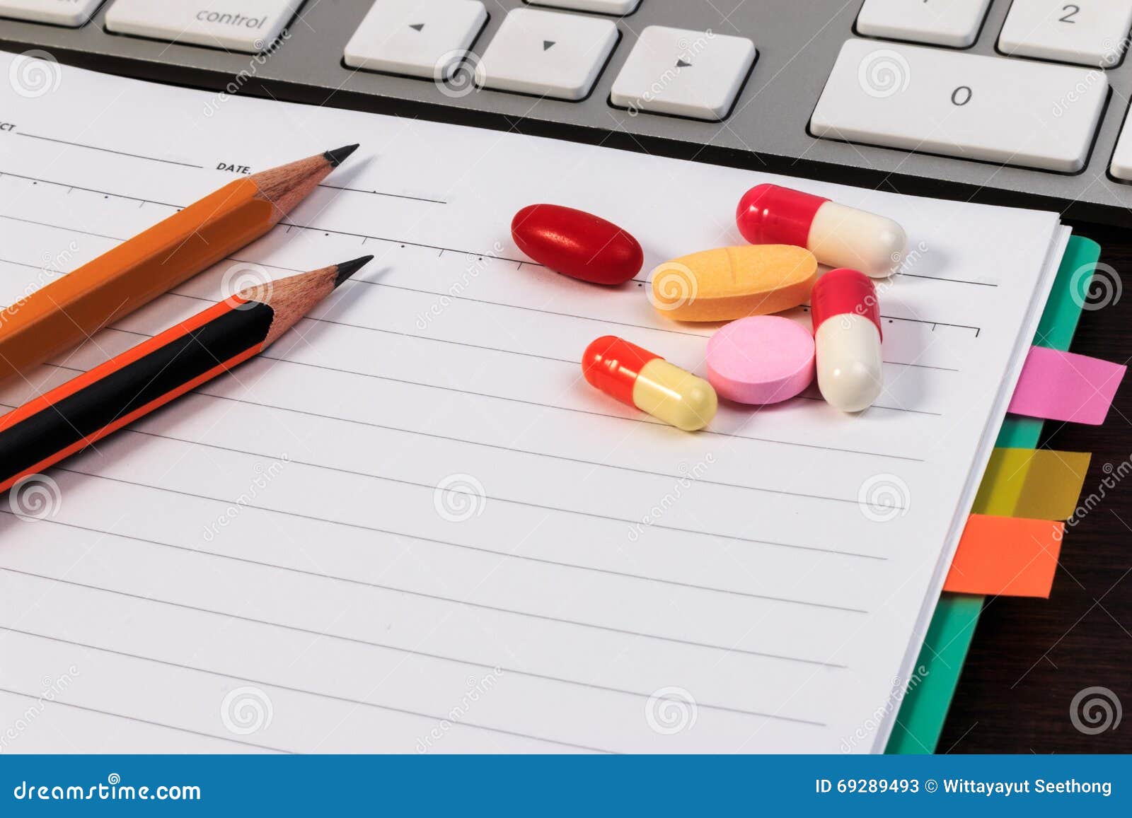 Pills, Capsule, Notebook, Pencils and Computer Keyboard on Wooden Table ...