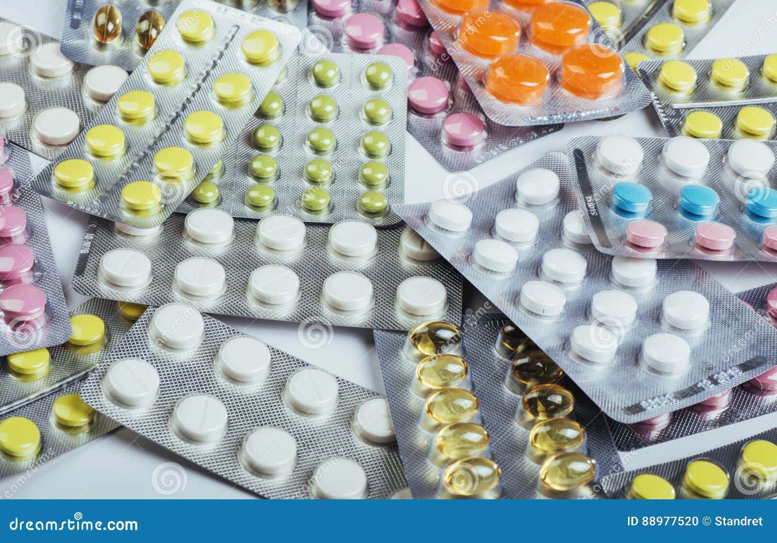 Pills of Different Colors Lie on the Surface in a Sealed Package. Stock ...