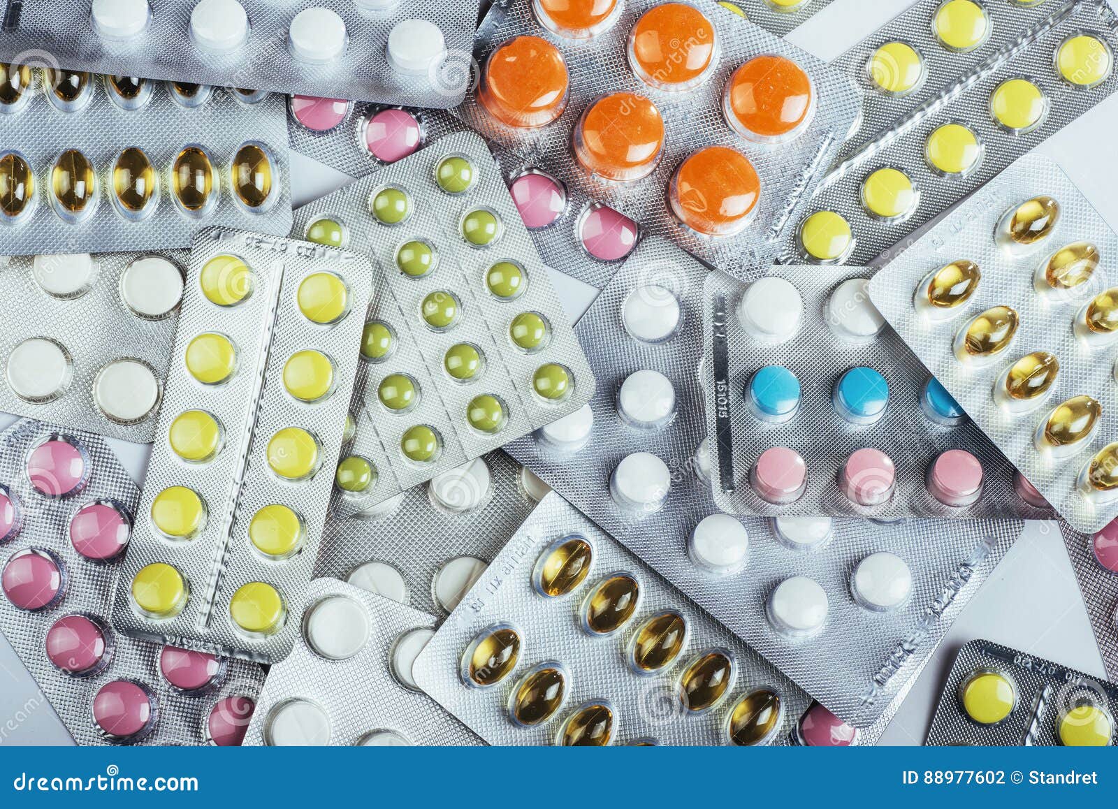 Pills of Different Colors Lie on the Surface in a Sealed Package. Stock ...