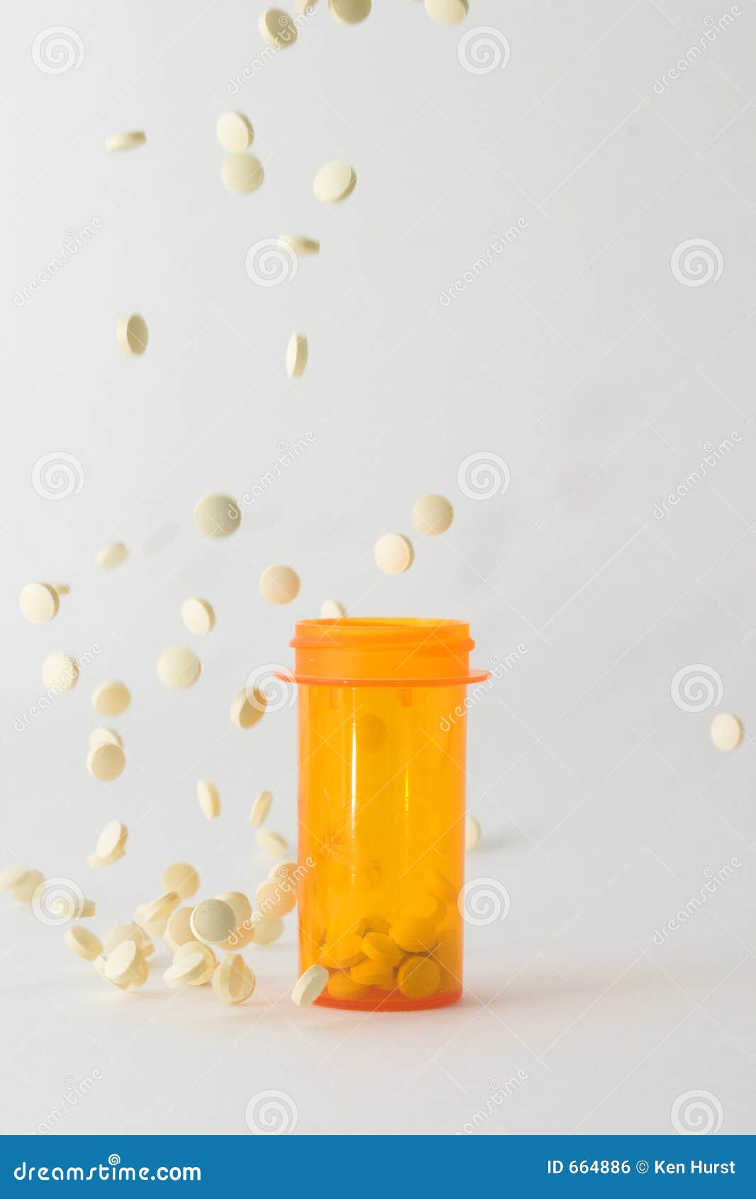 Pills Falling into and Around Medicine Bottle Stock Photo - Image of ...