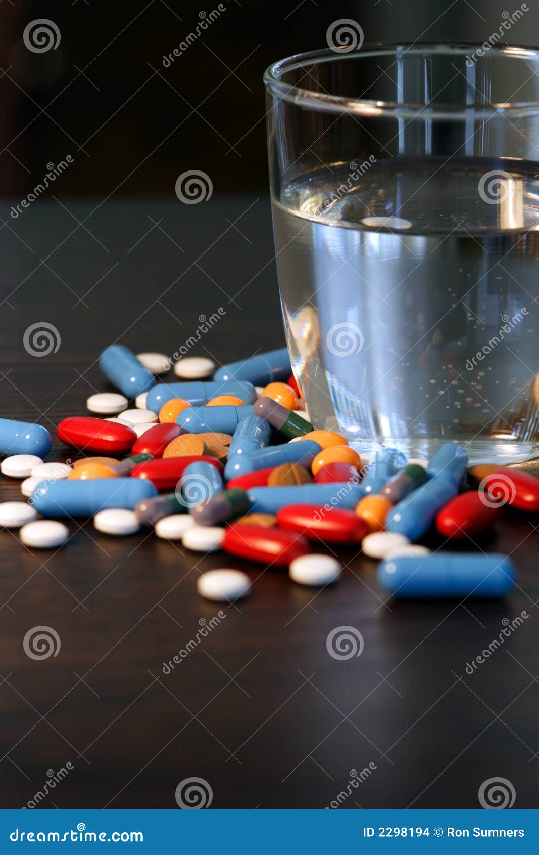 Pills and glass of water stock photo. Image of capsules - 2298194