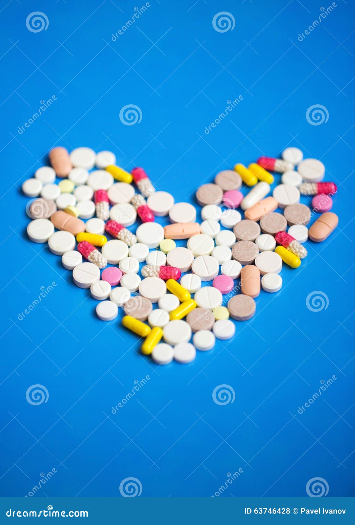Pills in a Heart Shape on a Blue. Stock Photo - Image of happy ...