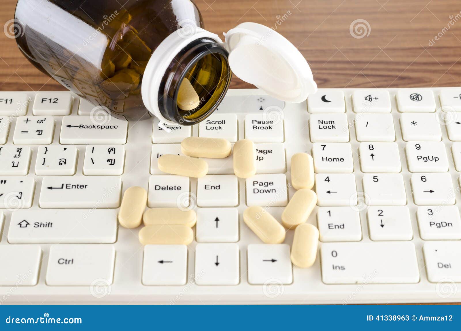Pills on keyboard computer stock image. Image of medicine - 41338963