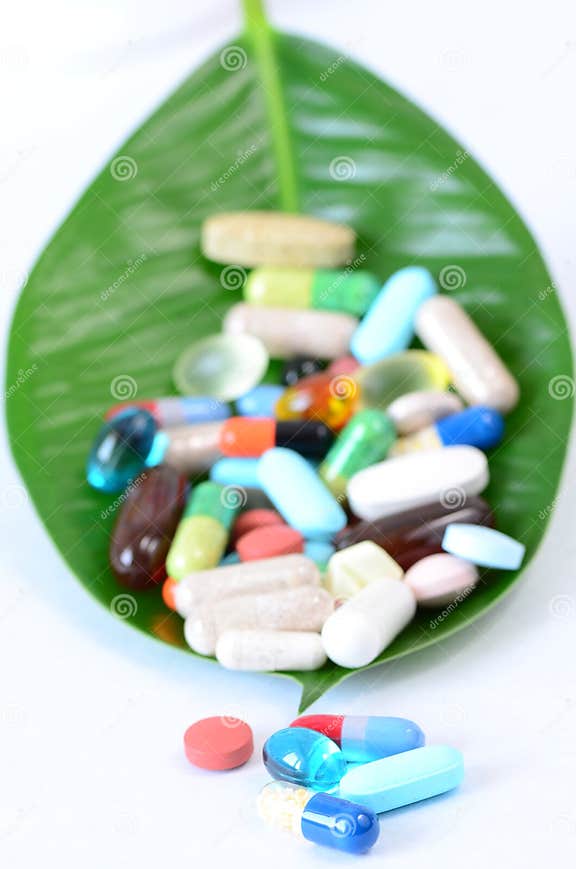 Pills on a leaf stock photo. Image of capsule, medical - 26949284