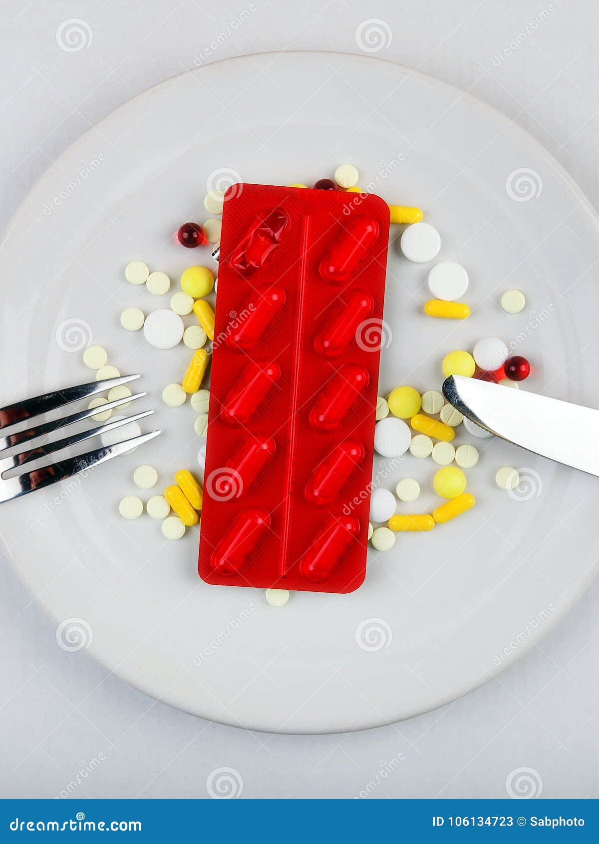 Pills on the Plate stock image. Image of fork, breakfast - 106134723