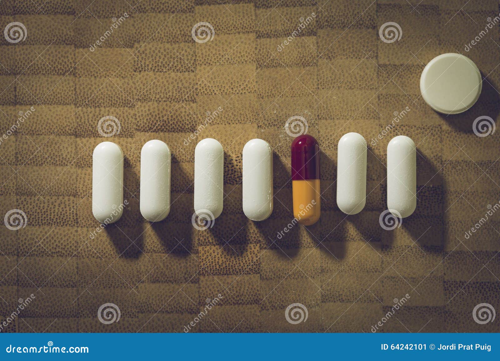 Pills in a Row with a Different Colored One Stock Image - Image of ...