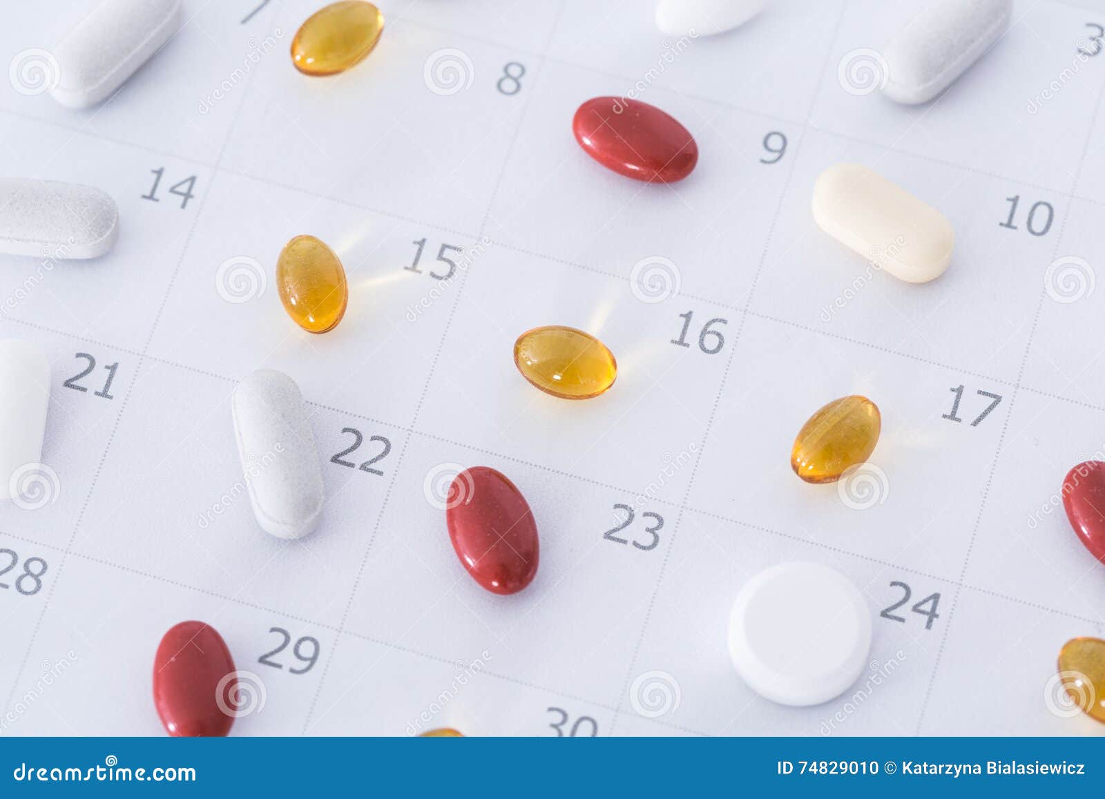 Pills on a schedule stock photo. Image of medication - 74829010