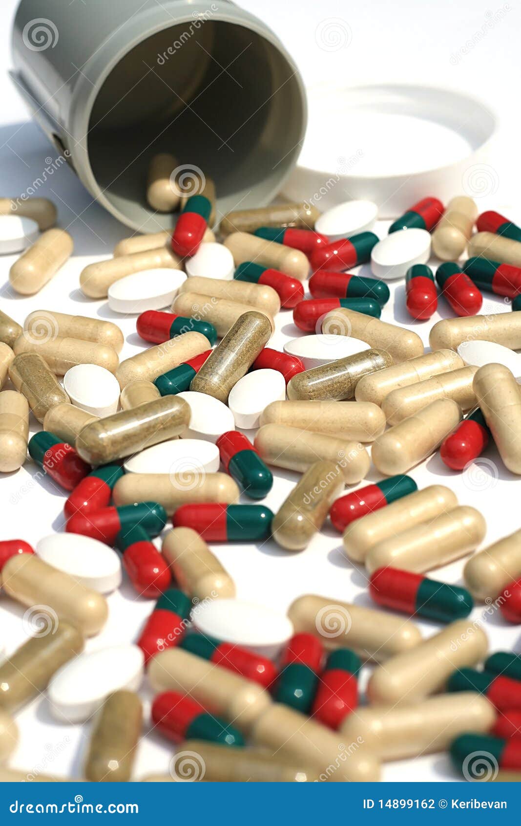 Pills Spill Out of Bottle stock photo. Image of chemistry - 14899162