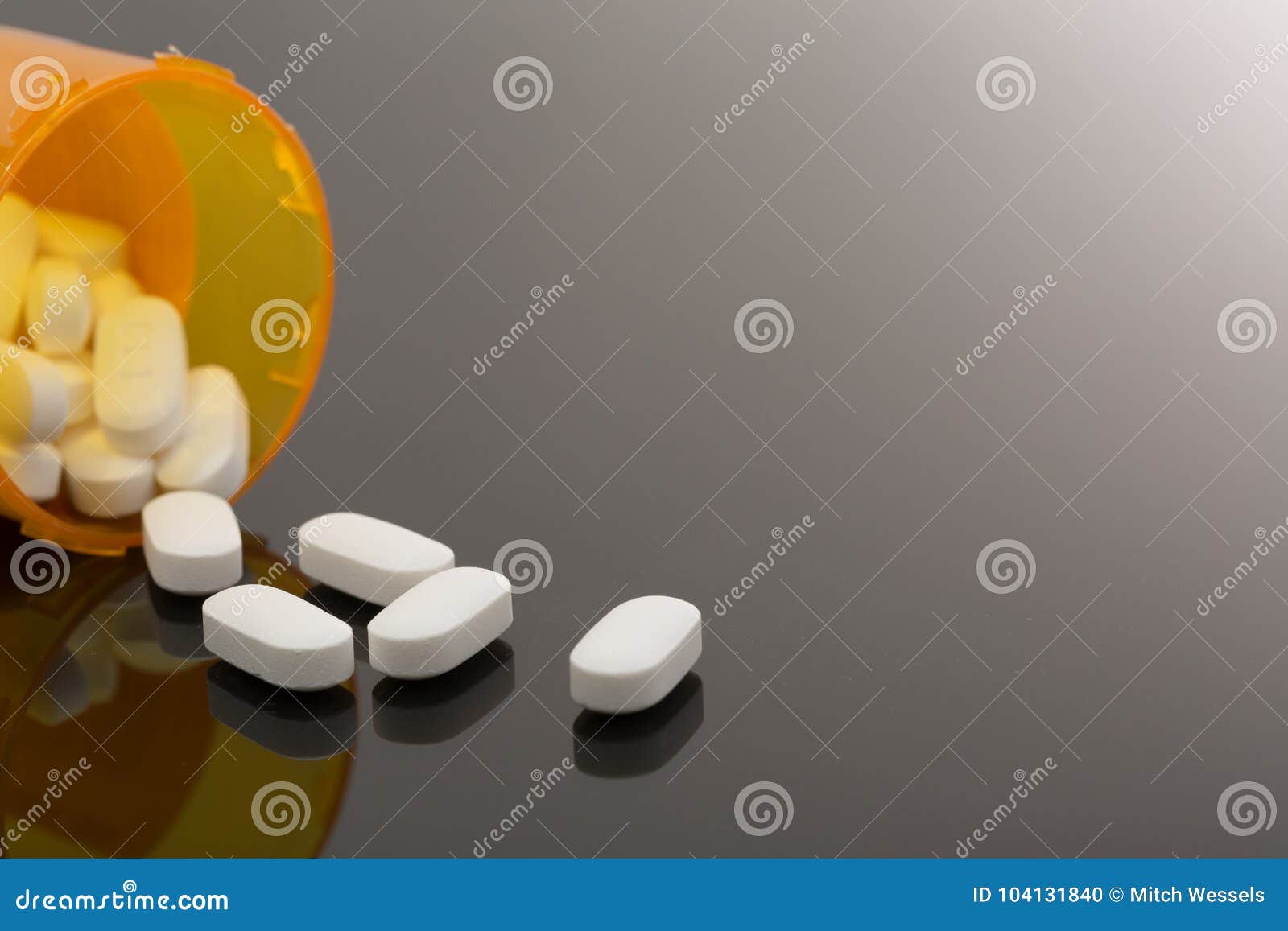 Pills spilled out on table stock photo. Image of pills - 104131840