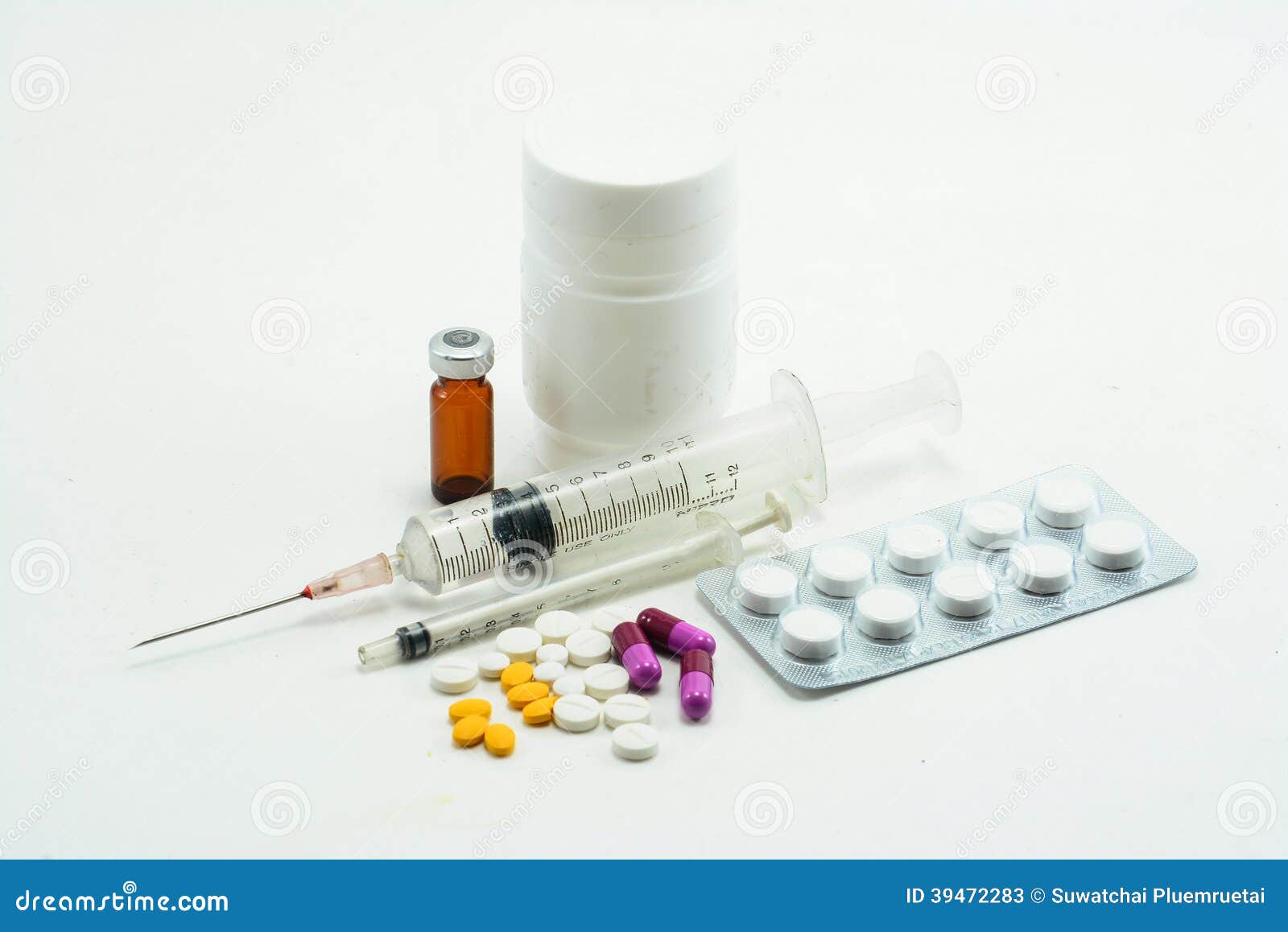 Pills Spilling Out of Pill Bottle and Syringe on White Stock Image ...