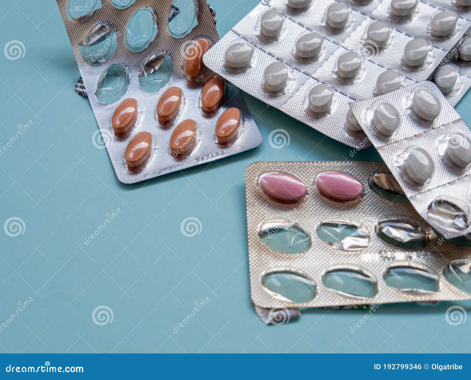 Pills and Tablets Inside Medicine Pack on Blue Background. Stock Photo ...