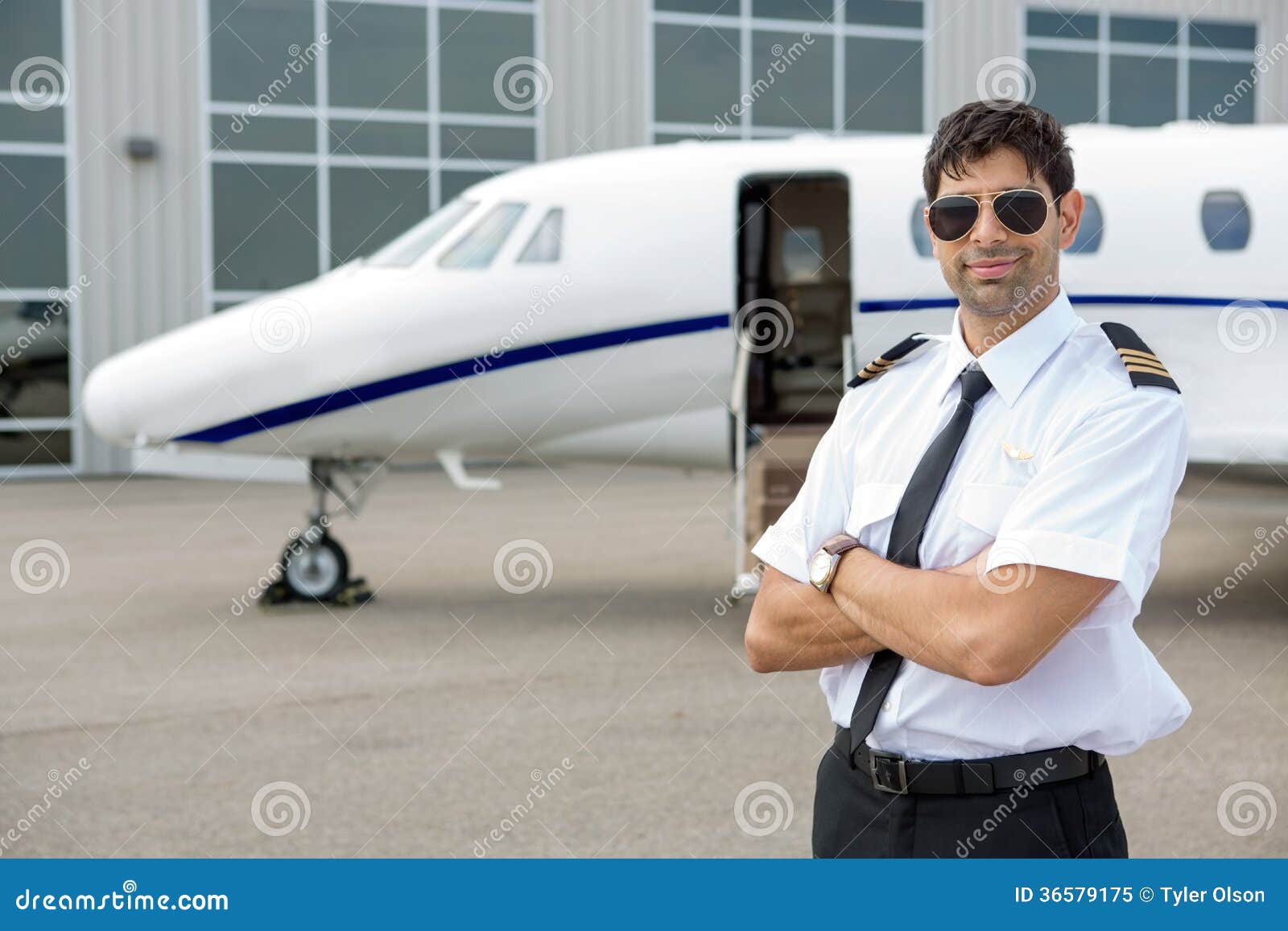 Pilot with Arms Crossed Standing in Front of Stock Image - Image of ...