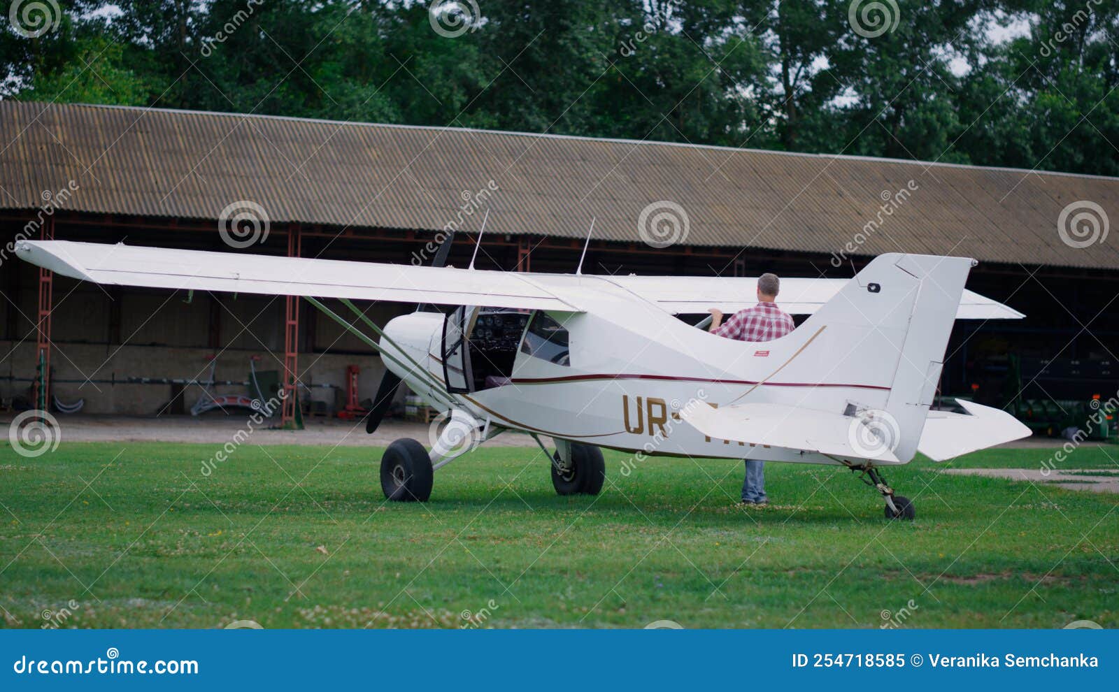 Pilot Checking Private Plane Standing Green Airfield. Making Preflight ...