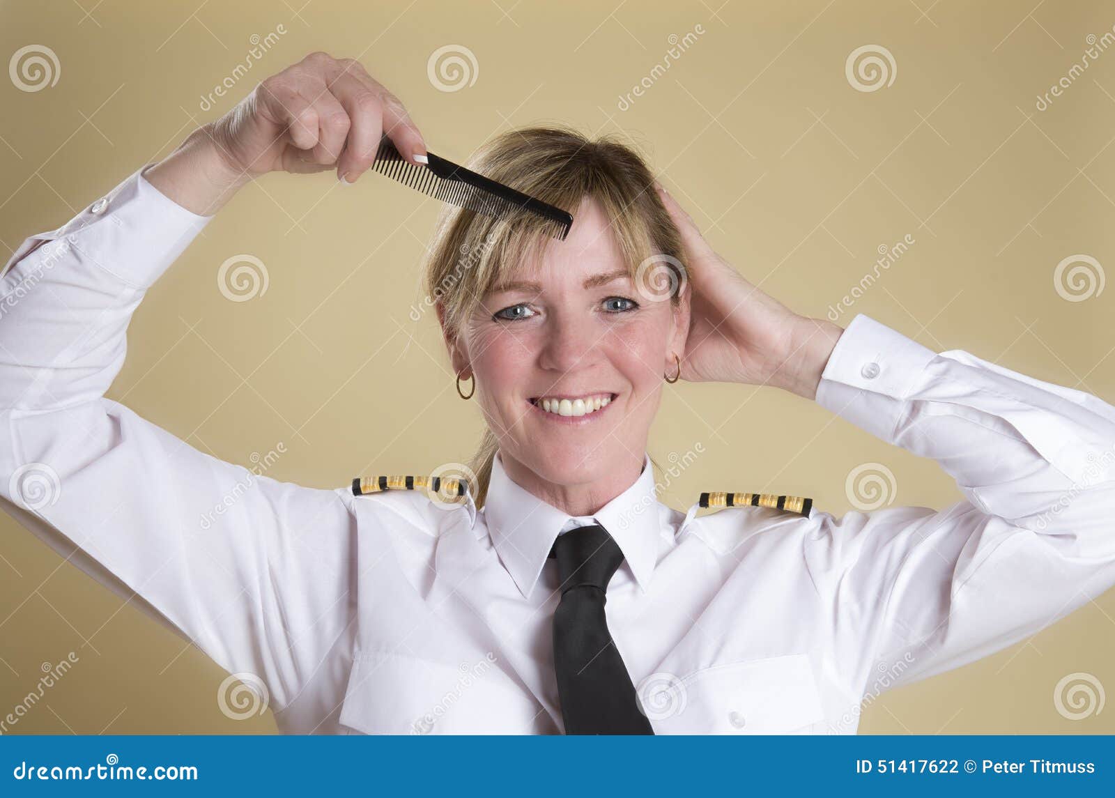 Pilot combing her hair stock photo. Image of insignia - 51417622