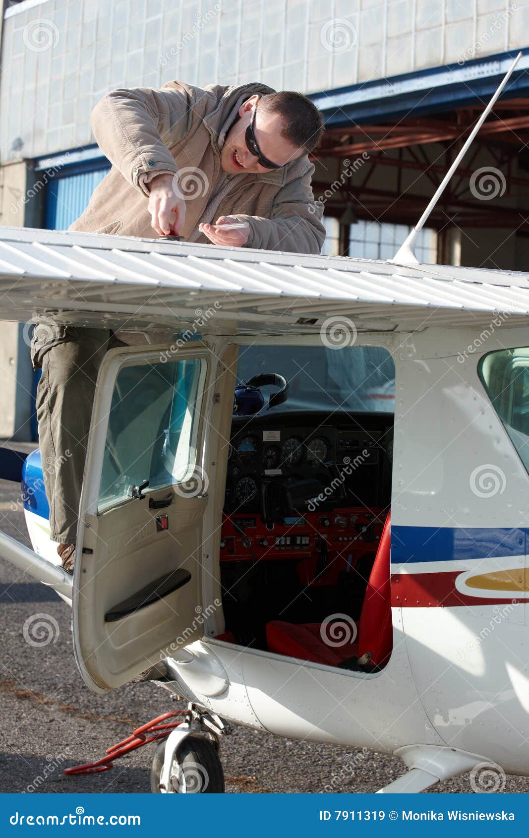 Pilot Doing Pre-flight Checking Stock Image - Image of person, aircraft ...