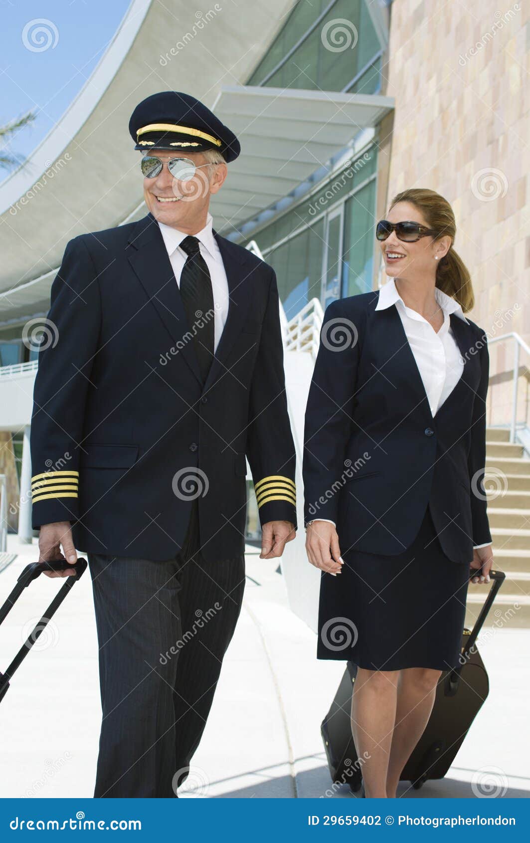 Pilot and Flight Attendant Outside Building Stock Photo - Image of ...