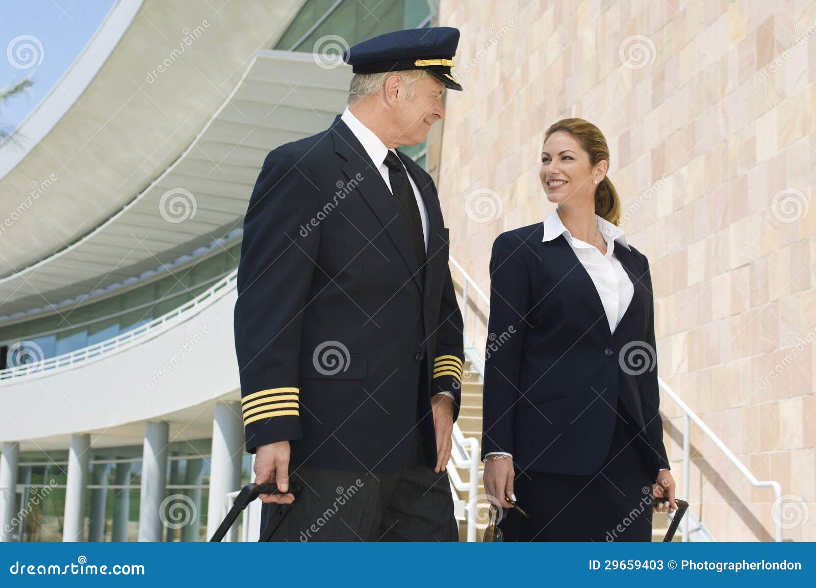 Pilot and Flight Attendant Outside Building Stock Image - Image of ...