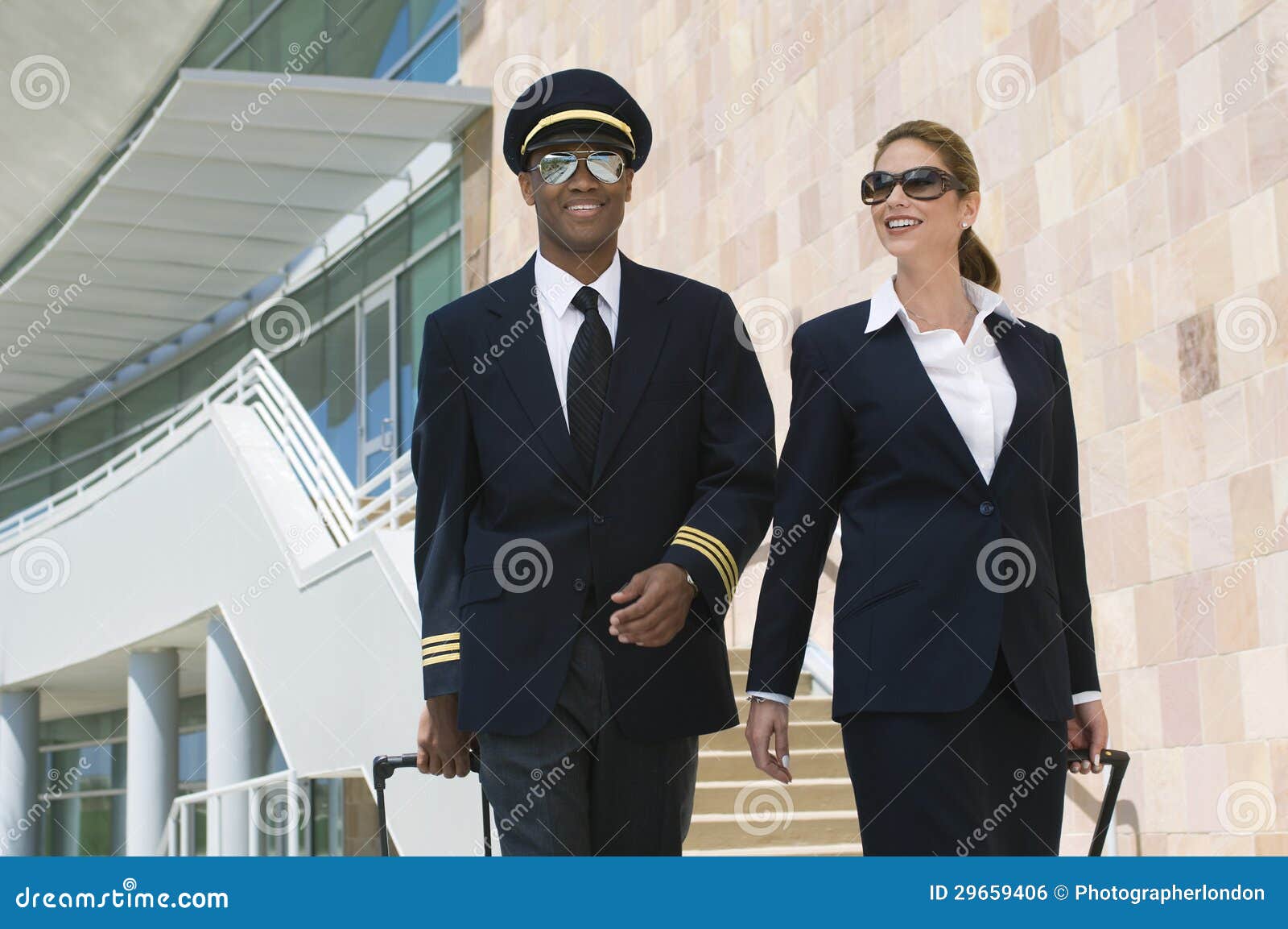 Pilot and Flight Attendant Outside Building Stock Photo - Image of ...