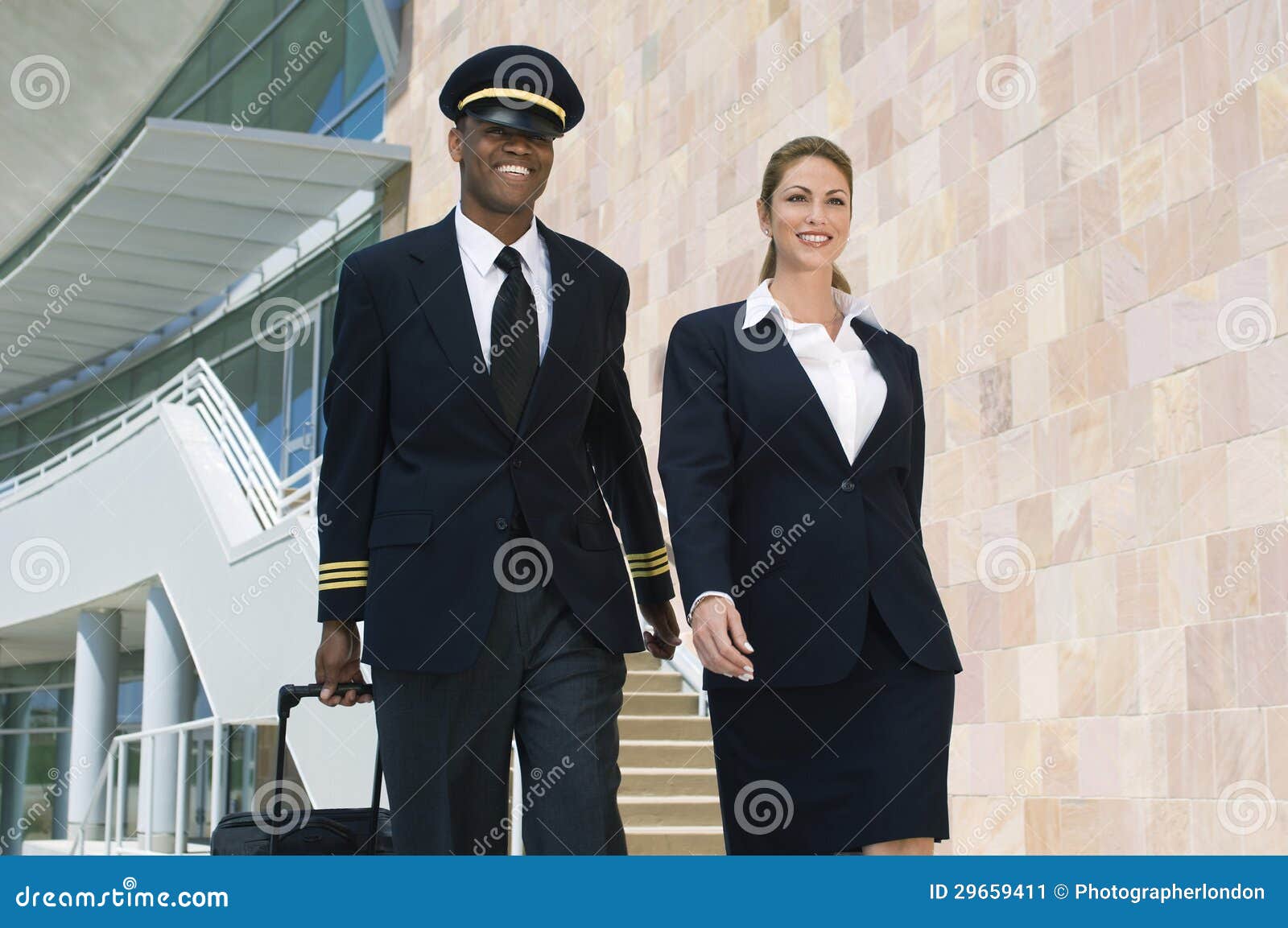 Pilot and Flight Attendant Walking Outside Building Stock Image - Image ...