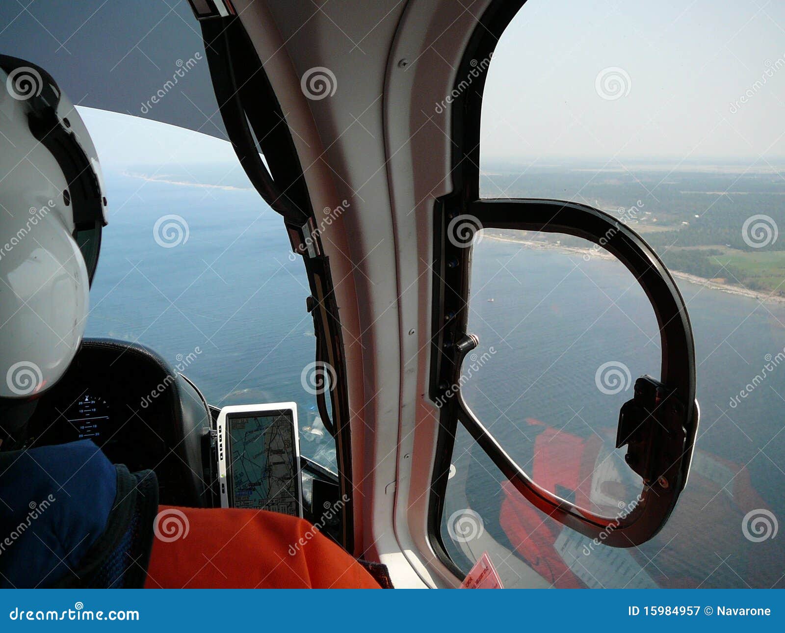 Pilot flying helicopter stock image. Image of ocean, cockpit - 15984957