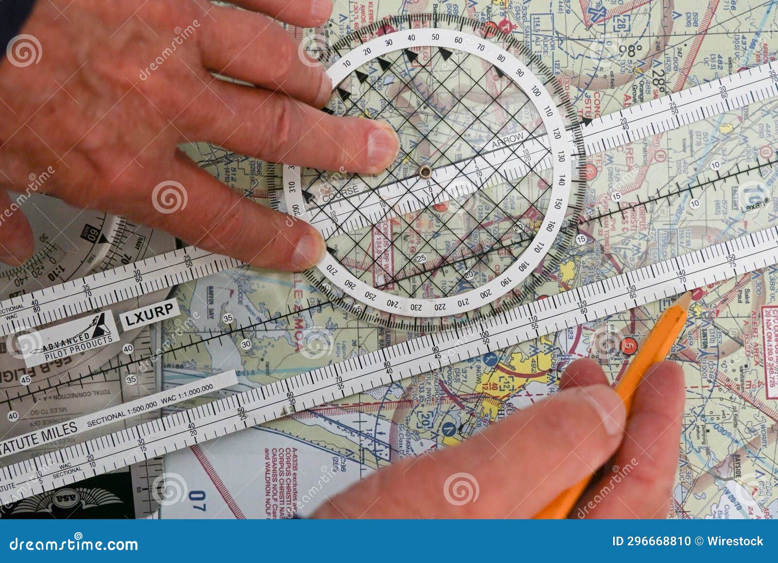 Pilot Plots a Flight on a Sectional Map for a Vector from One Airport ...
