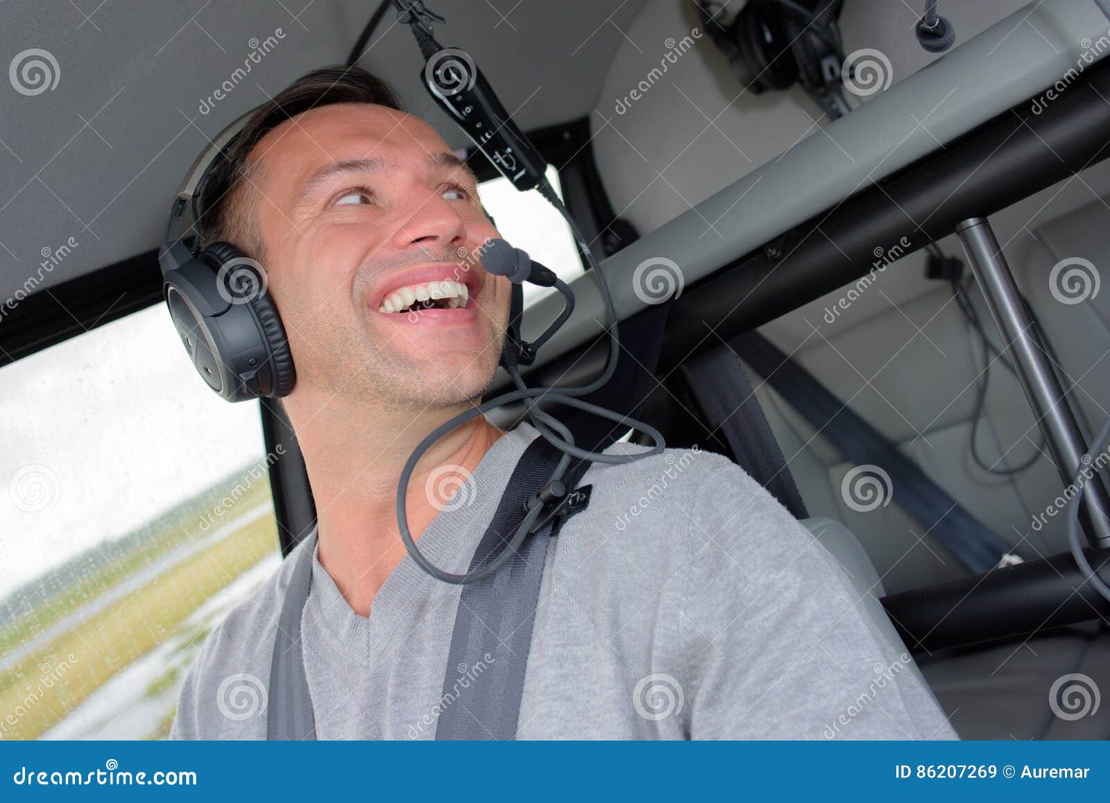 Pilot Smiling and Looking Over Shoulder Stock Image - Image of cockpit ...