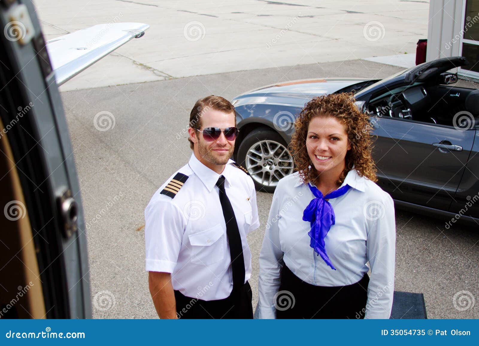 Pilot and Stewardess Standing Outside Airplane Stock Image - Image of ...