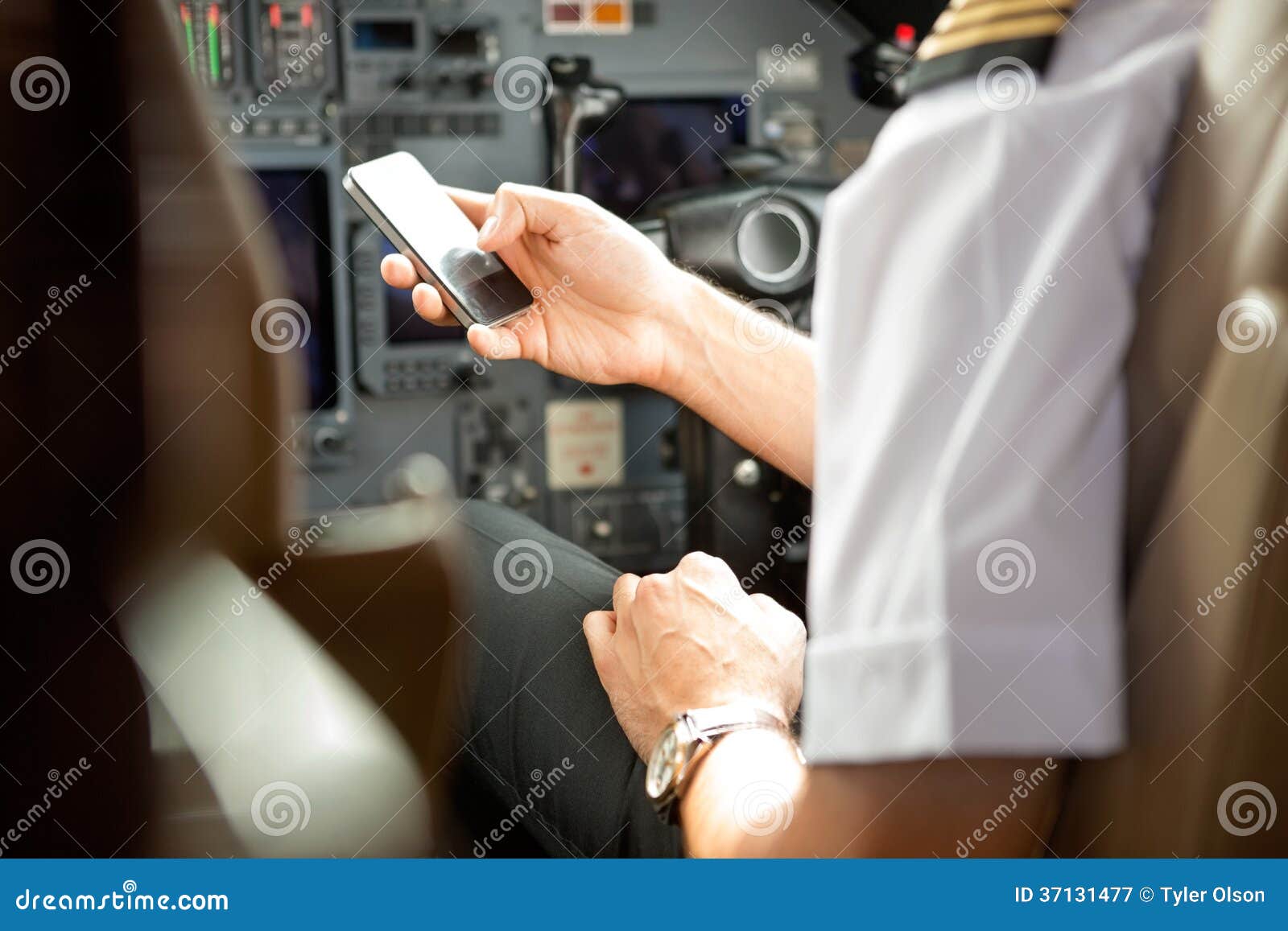 Pilot Using Cell Phone in Cockpit Stock Image - Image of captain ...