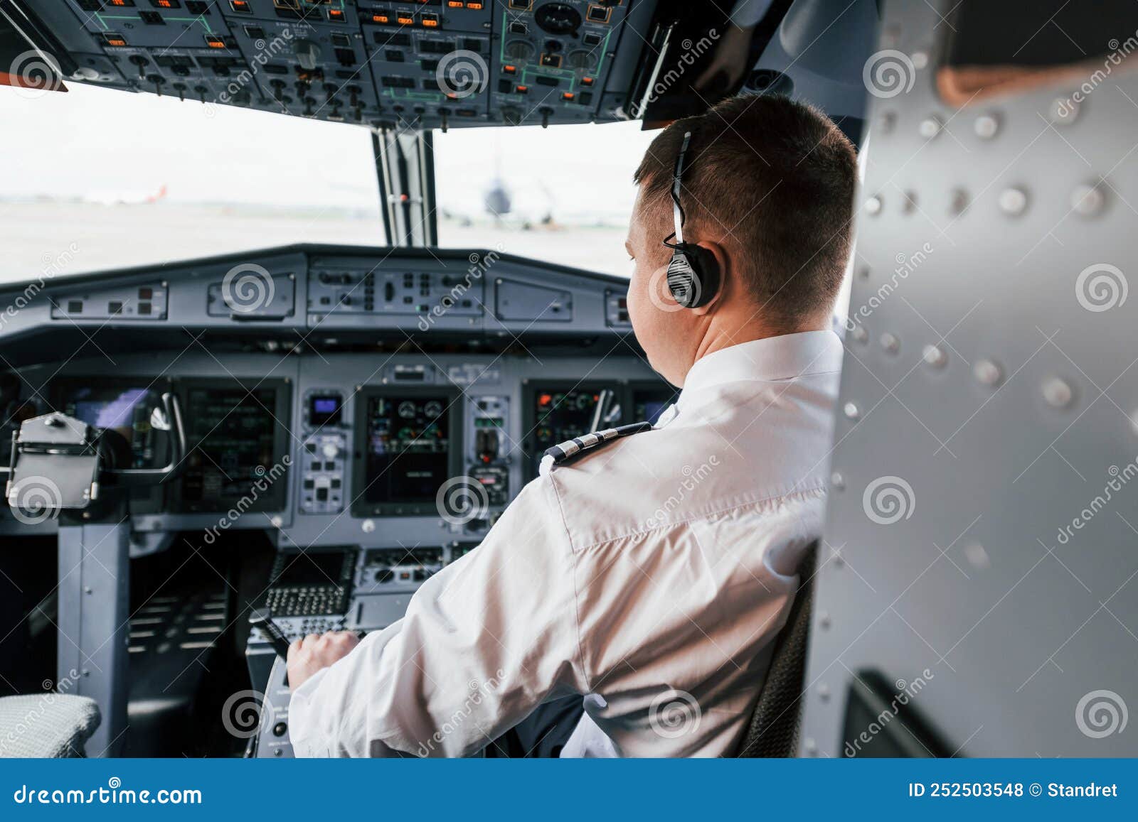 Pilot on the Work in the Passenger Airplane. Preparing for Takeoff ...