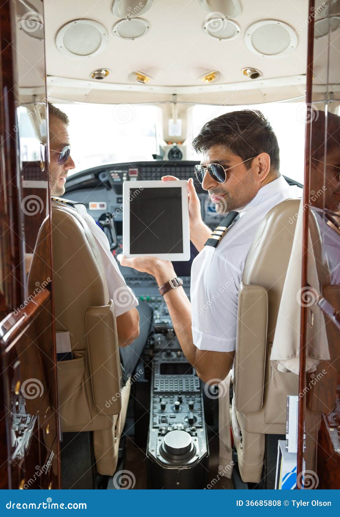 Pilots Using Digital Tablet in Cockpit Stock Photo - Image of copyspace ...