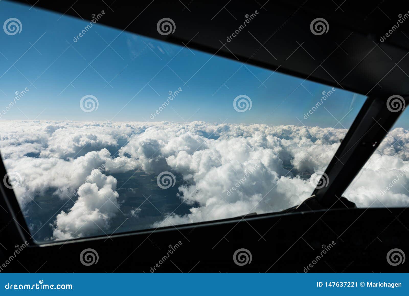 Pilots View Out of the Cockpit Window Toward Clouds and Blue Sky Above ...