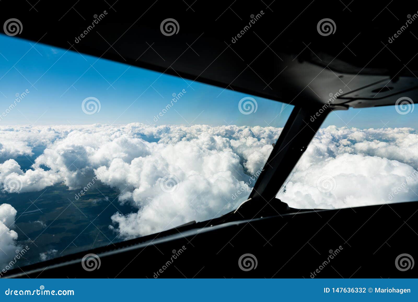 Pilots View Out of the Cockpit Window Toward Clouds and Blue Sky Above ...