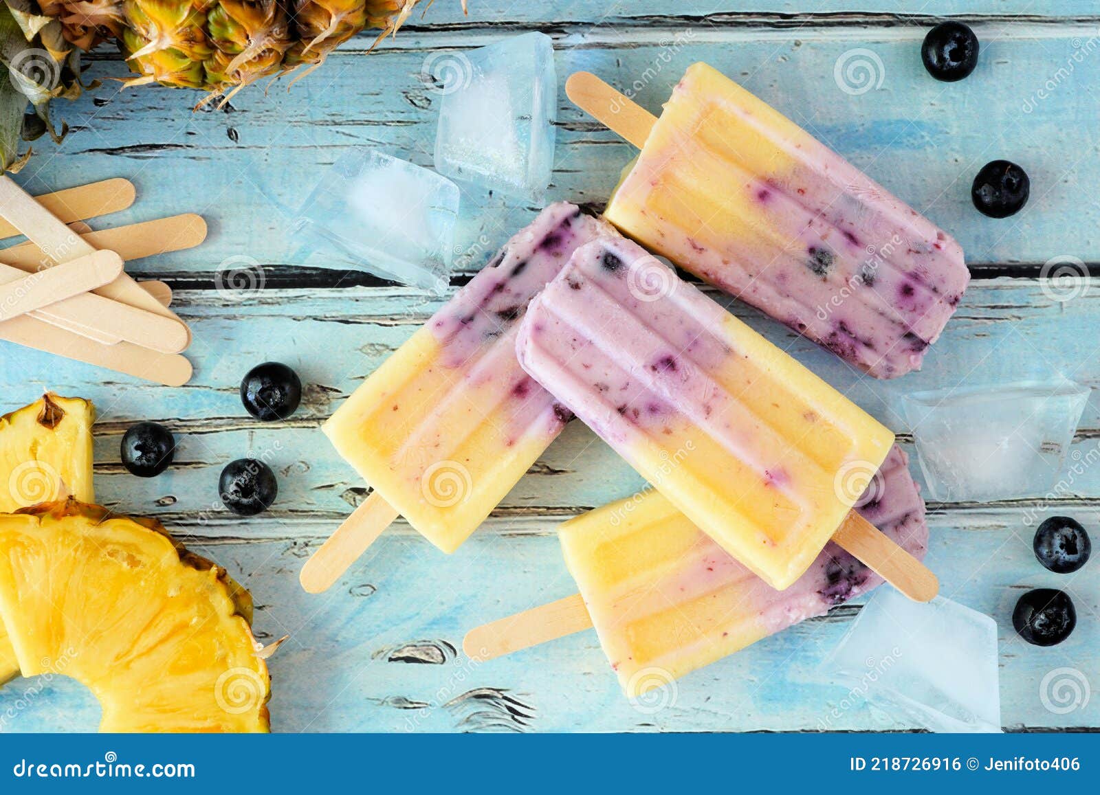 Pineapple Blueberry Popsicles. Top View Table Scene Over Blue Wood ...