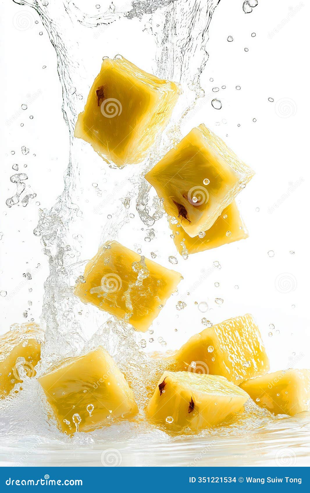 Pineapple Cubes Splashing into Water on White Background Stock ...