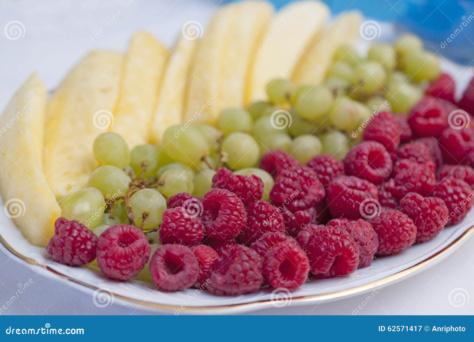 Pineapple, Grapes and Raspberries on a Plate Stock Image - Image of ...