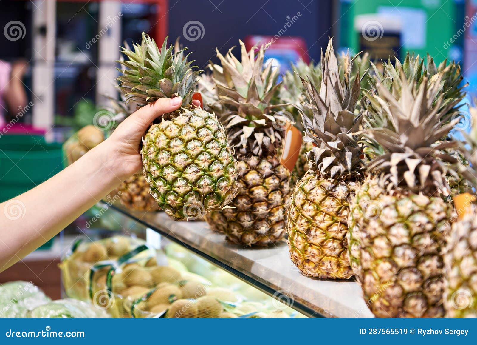 Pineapple in Hand of Buyer in Shop Stock Image - Image of store, shop: 287565519
