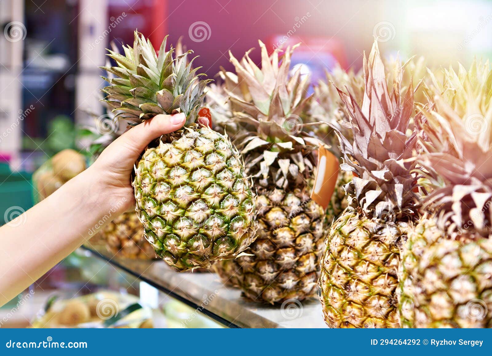 Pineapple in hand in shop stock photo. Image of consumerism - 294264292