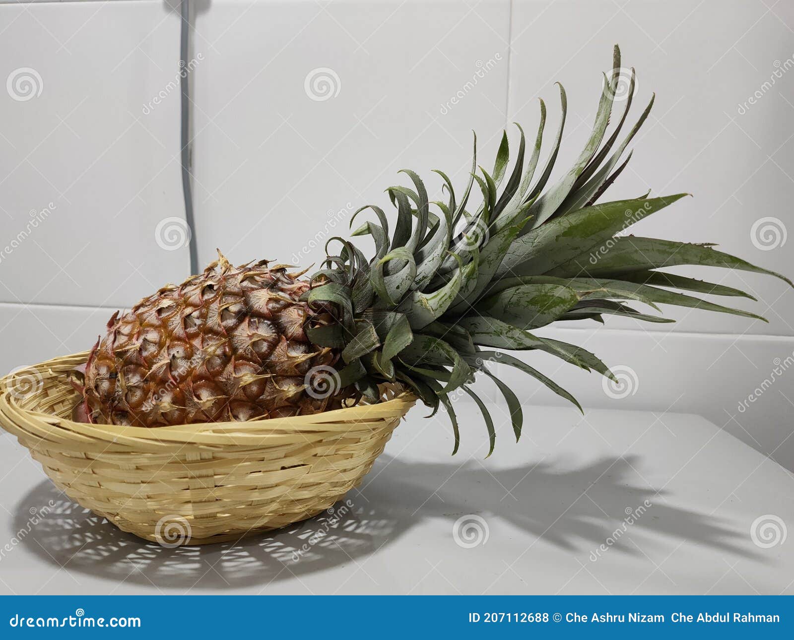 A Pineapple Inside the Bamboo Basket with Nice Shadow. Stock Photo ...