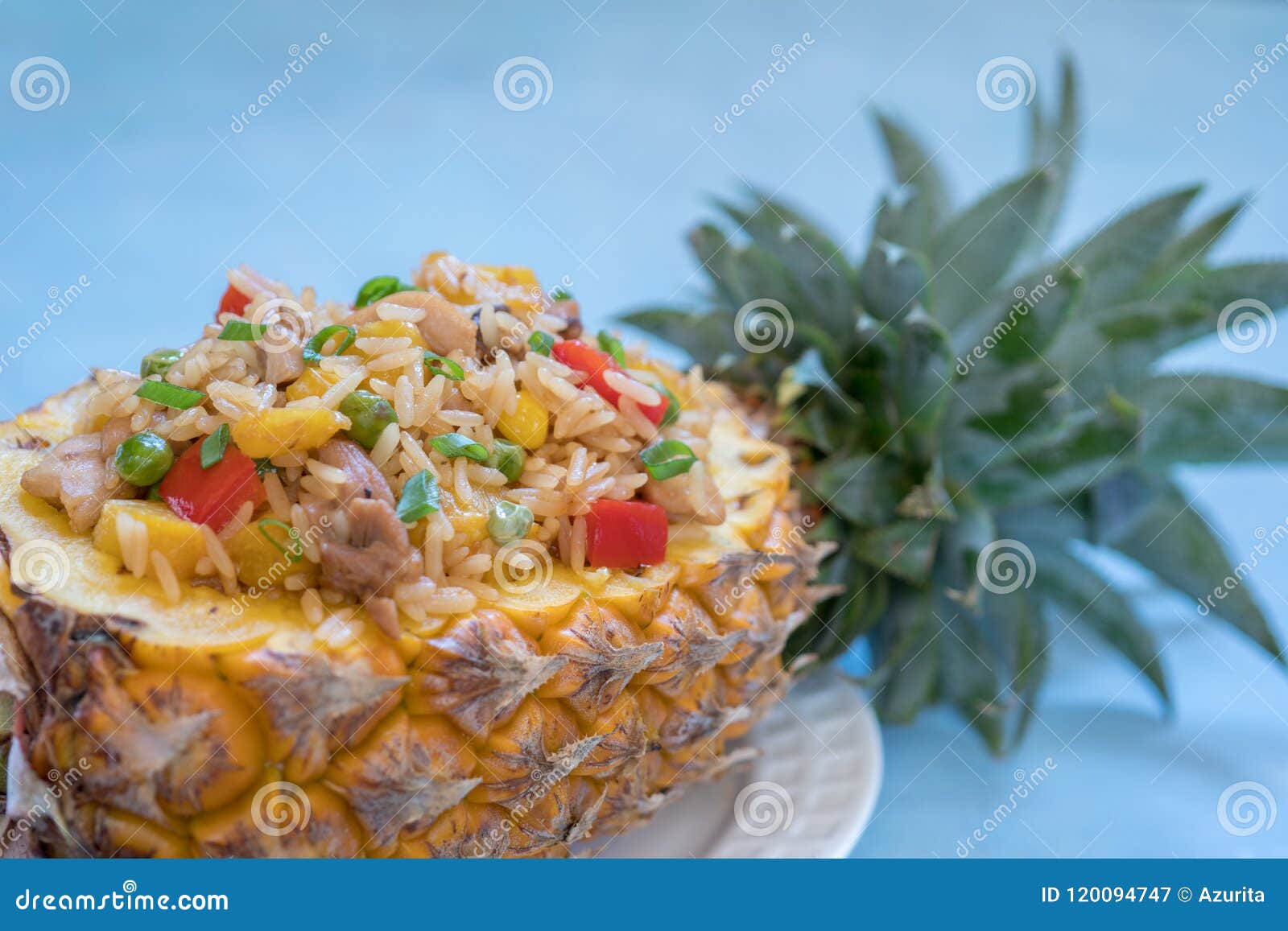 Pineapple Stuffed with Fried Rice, Chicken and Vegetables Stock Image ...