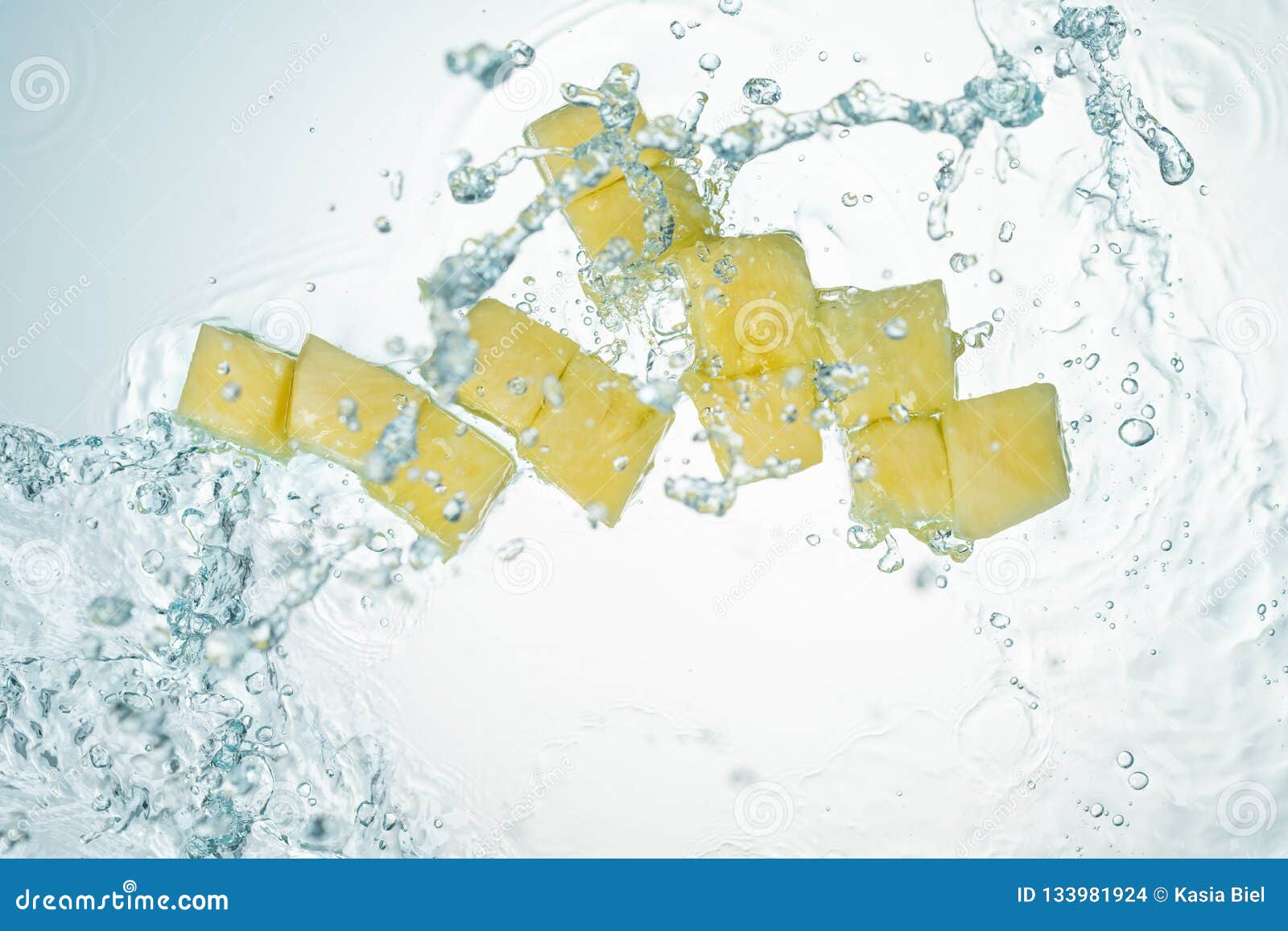 Pineapple Water Splash stock photo. Image of chunks - 133981924