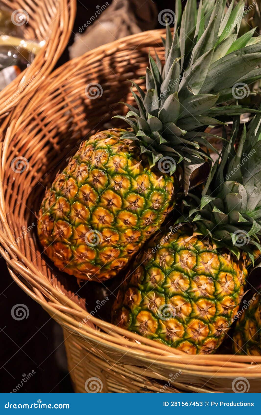 Pineapples Fruit in a Basket at the Supermarket. Stock Image - Image of ...