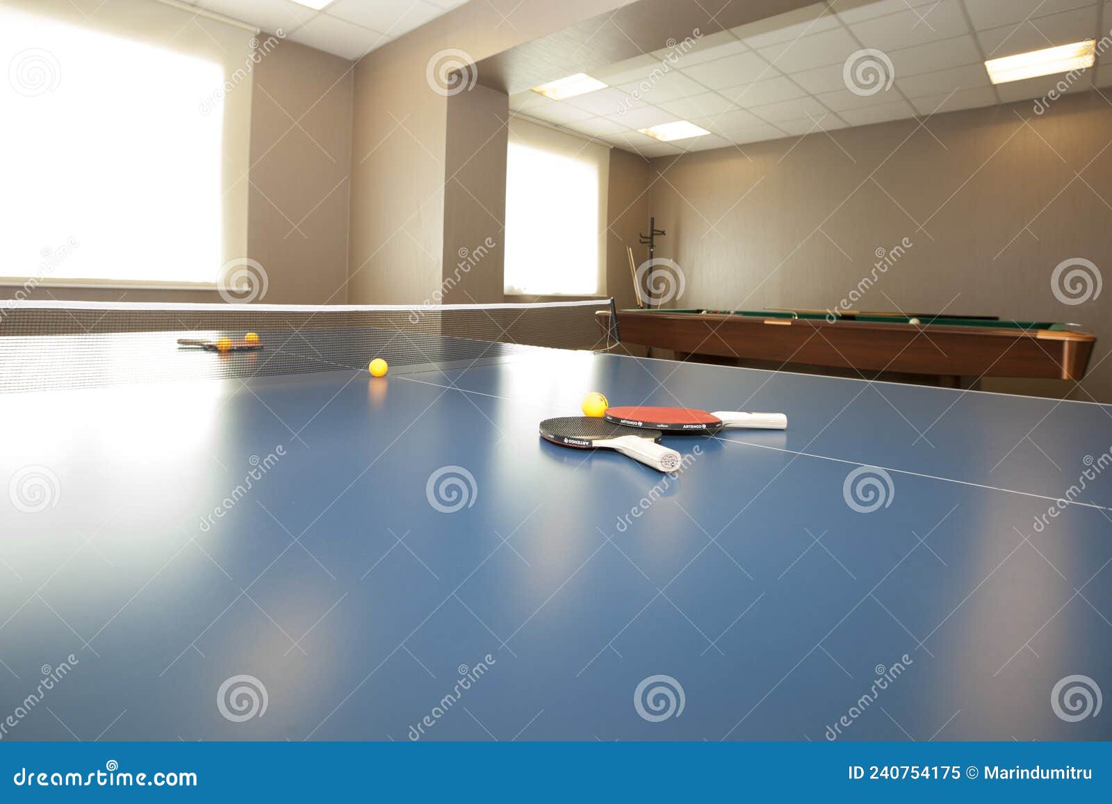 Ping Pong Table Ready for Play Inside with Balls and Rackets in ...